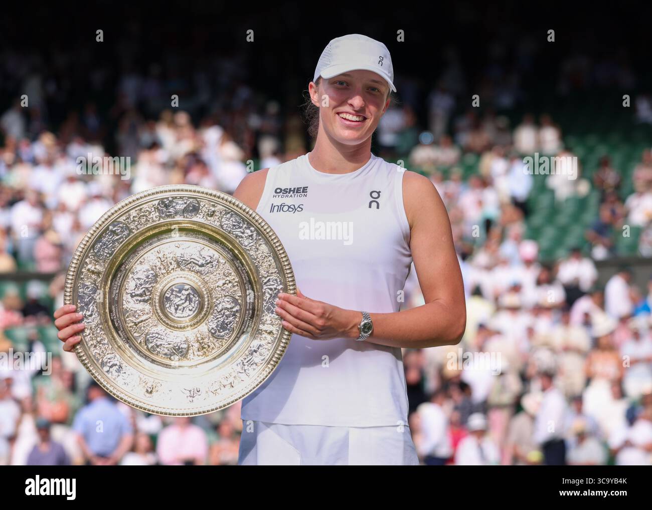 Polish tennis player Iga Swiatek holding the winners trophy at the 2025 ...