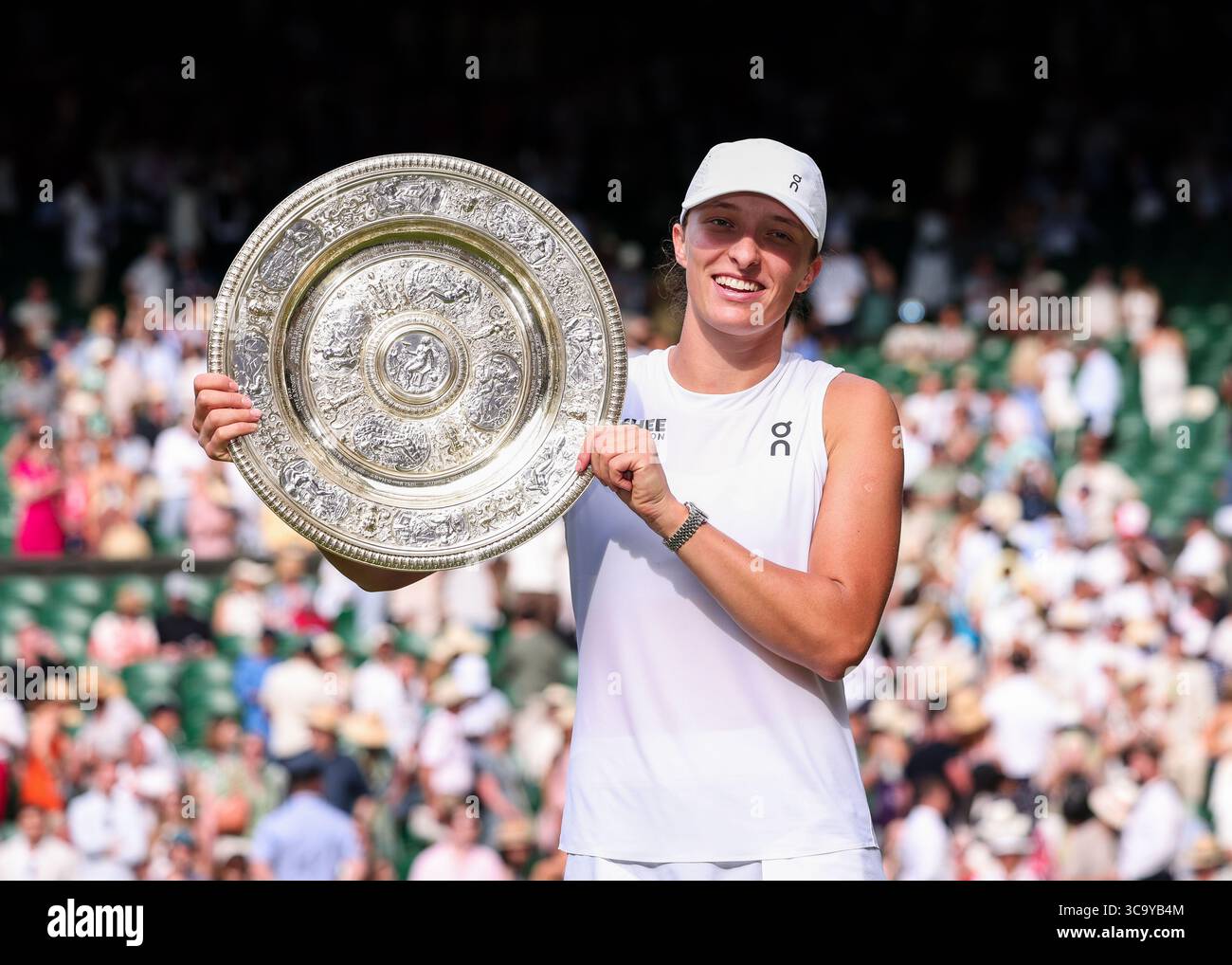 Polish tennis player Iga Swiatek holding the winners trophy at the 2025 ...