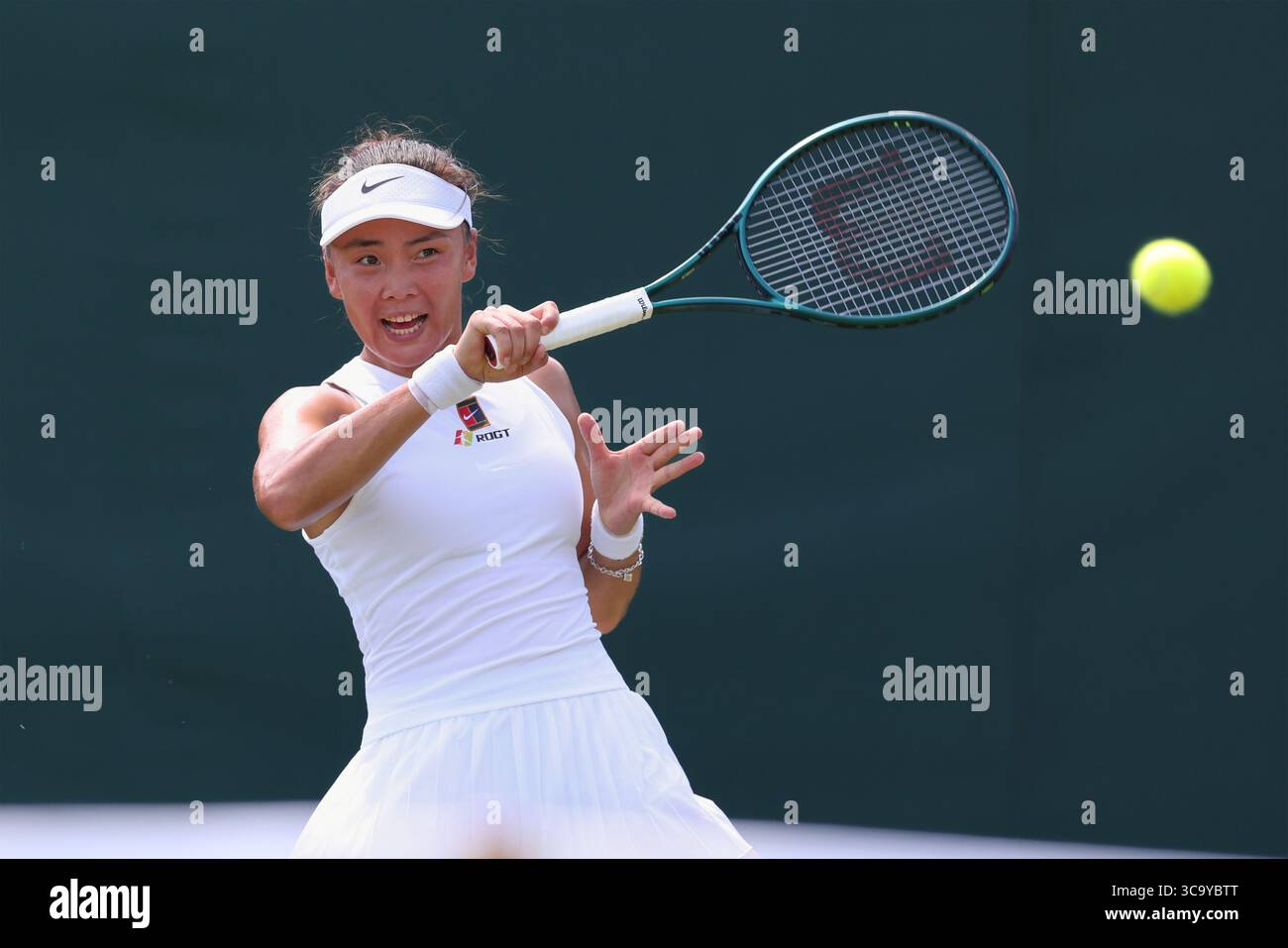Chinese tennis player Yue Yuan (CHN) in action at the 2025 Wimbledon ...