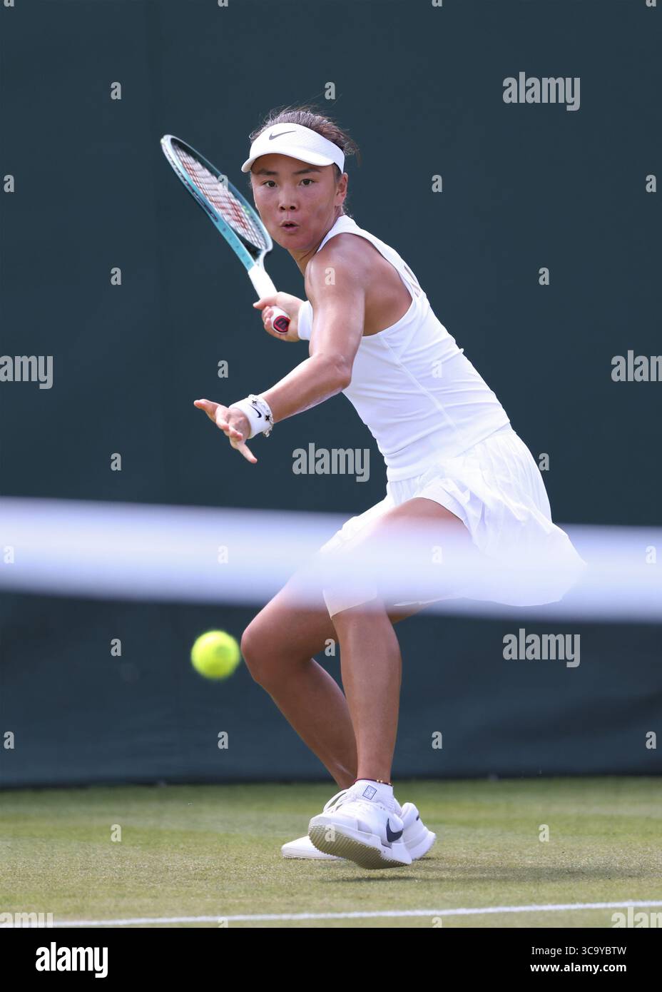 Chinese tennis player Yue Yuan (CHN) in action at the 2025 Wimbledon ...