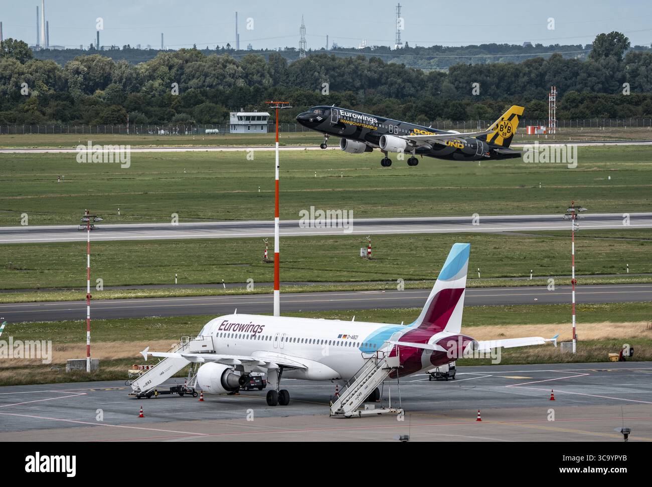 Duesseldorf Airport, Eurowings aircraft taking off, Eurowings Airbus on the apron, BVB Borussia ...