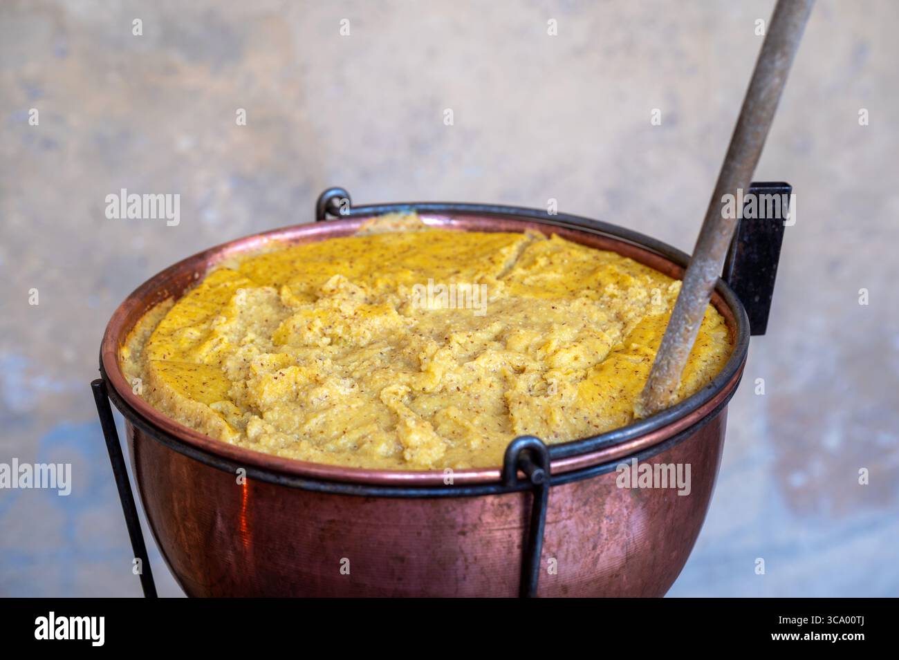 Cooking yellow polenta porridge detail hi-res stock photography and ...