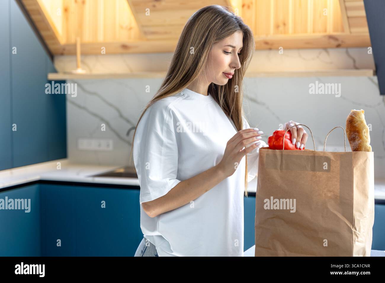 Unpacking groceries bread pepper hi-res stock photography and images ...