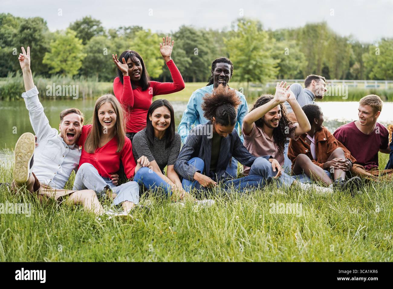 Group of diverse people having fun outdoor at city park - Diversity ...