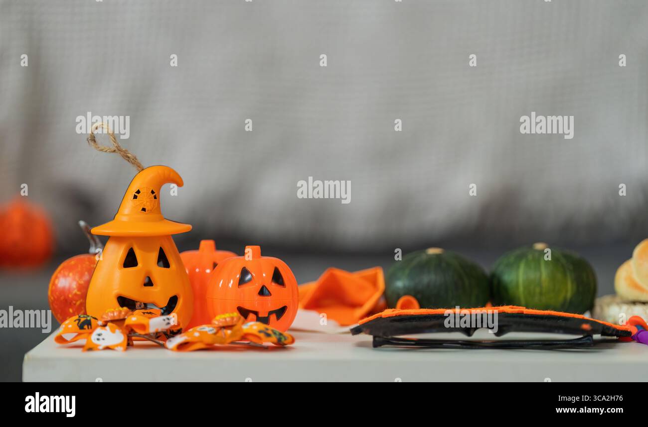 Halloween Decorations. Colorful pumpkin and spooky items arranged for ...
