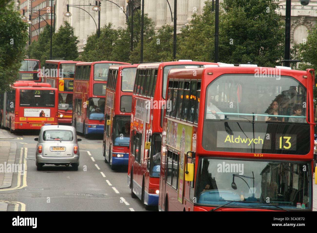 red buses on oxford street london Stock Photo - Alamy
