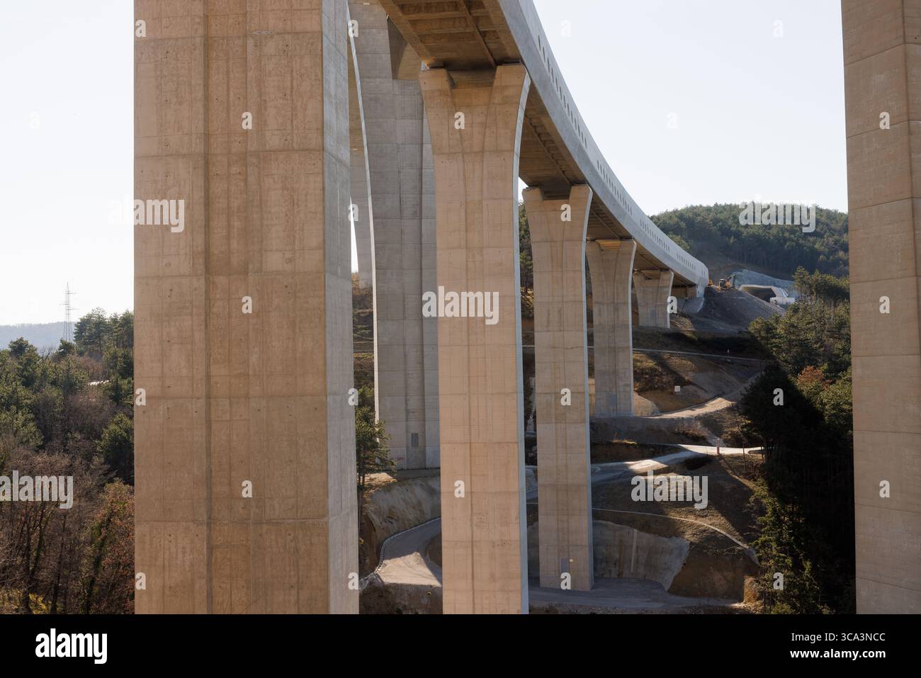 Construction site of a precast concrete highway viaduct in a hilly ...