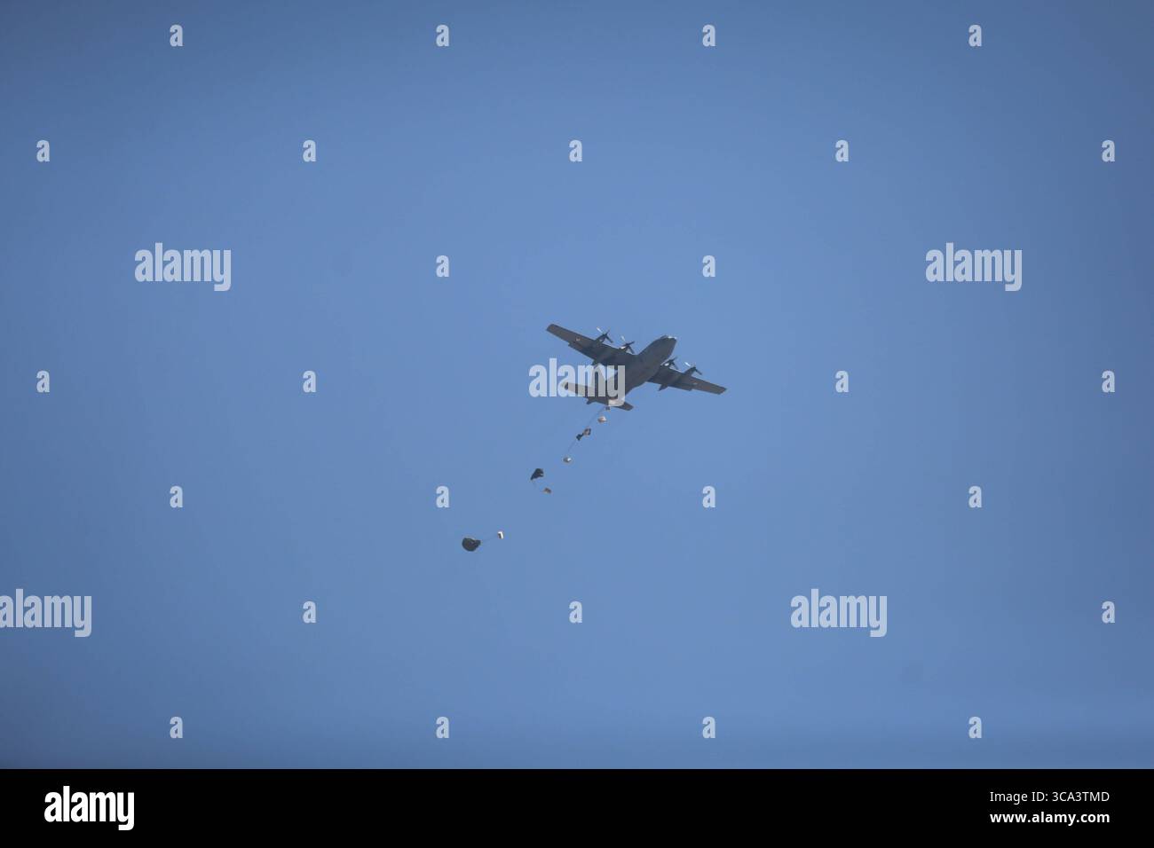 An airplane drops humanitarian aid An airplane drops humanitarian aid ...