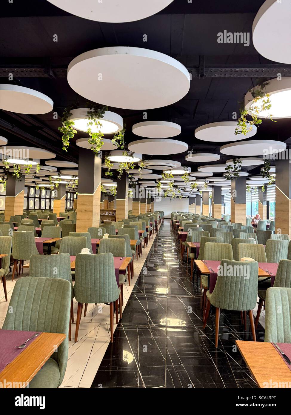 Stylish dining hall in resort all-inclusive restaurant. Tables with ...