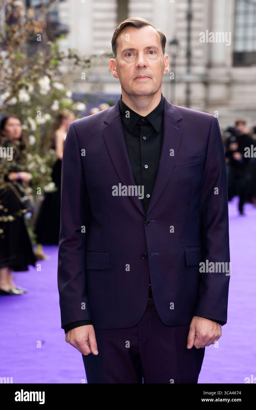 Miles Millar poses for photographers upon arrival at the season two ...