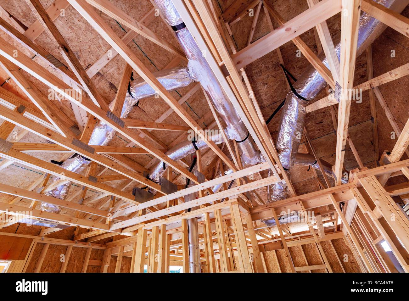 Construction site roof frame intricate wooden framework, ventilation ...