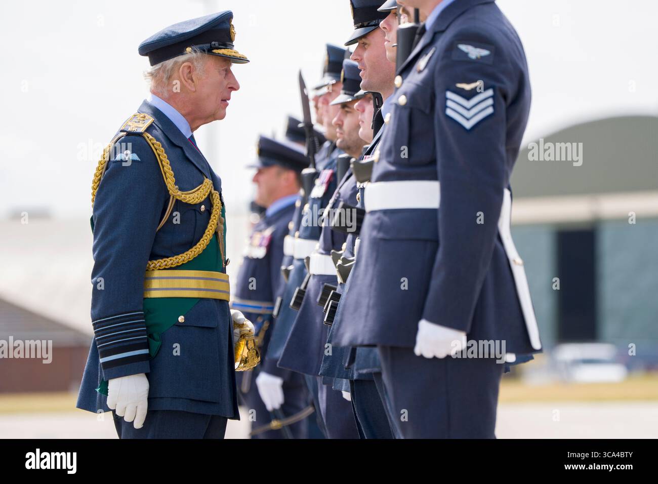 King Charles III inspects members of 42 (Torpedo Bomber) Squadron during a visit to RAF ...