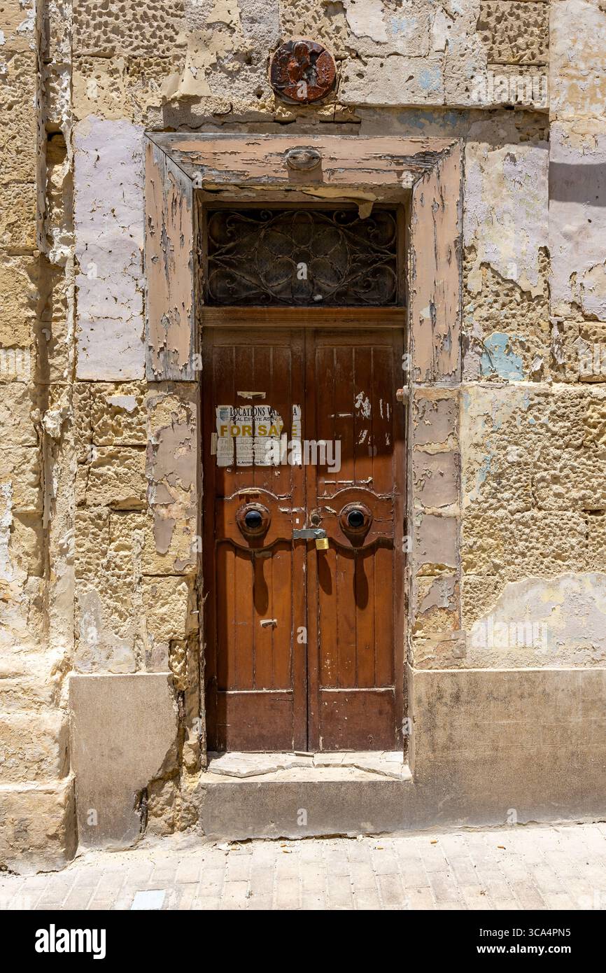 Buildings of a vernacular architecture of limestone blocks, typical of ...