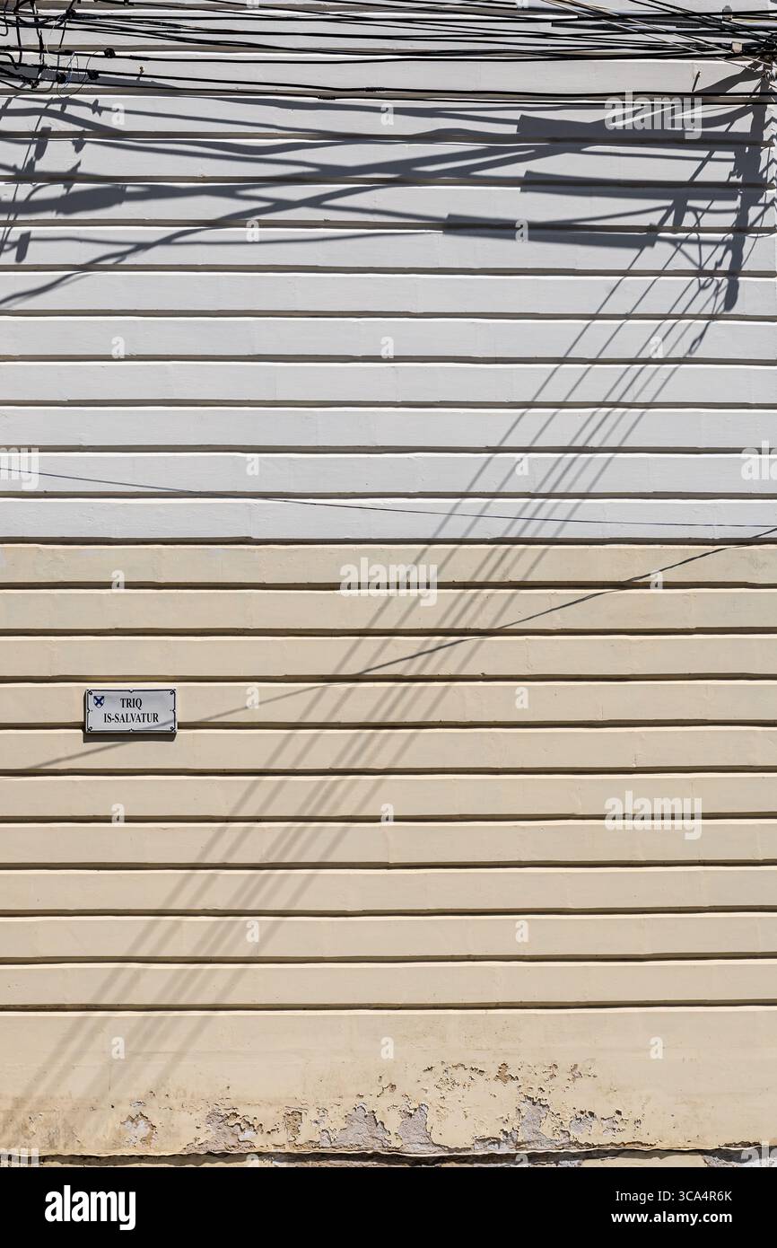 Abstract texture image of panel clad building with cables and shadows ...