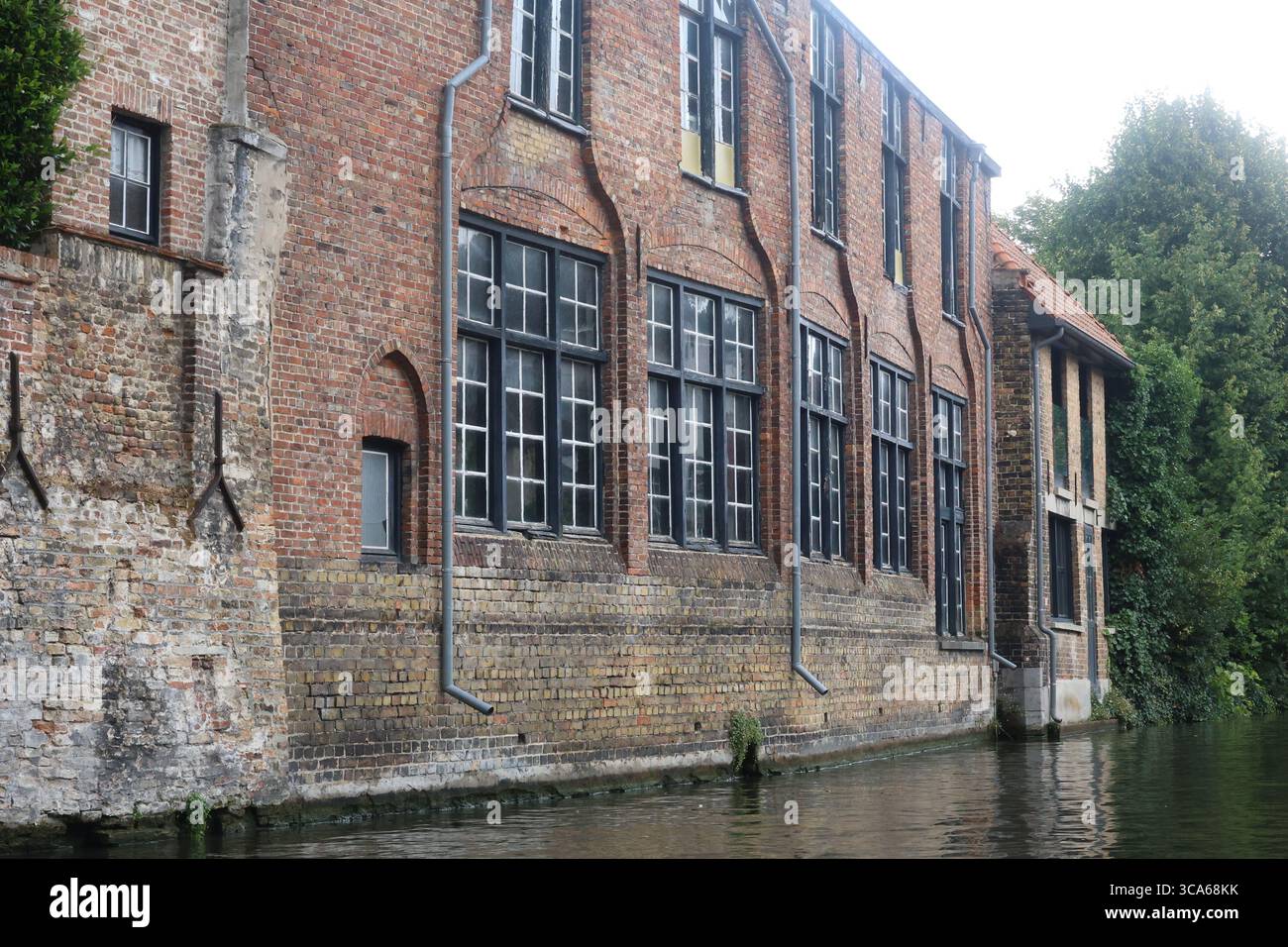 Historic brick building with large windows in Bruge, Belgium on 02nd ...