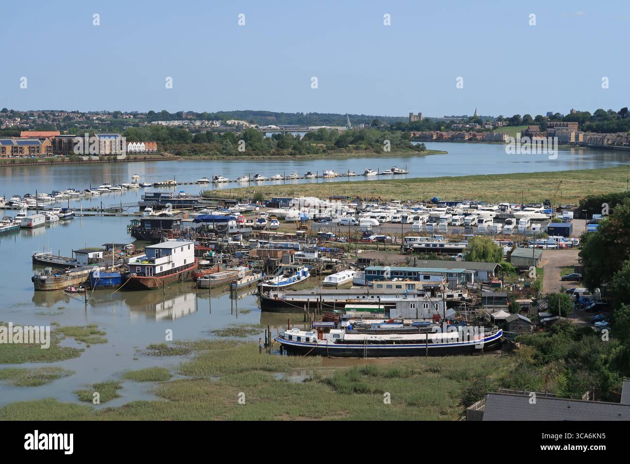 Houseboats and boatyard on the River Medway near Rochester, Kent, UK ...