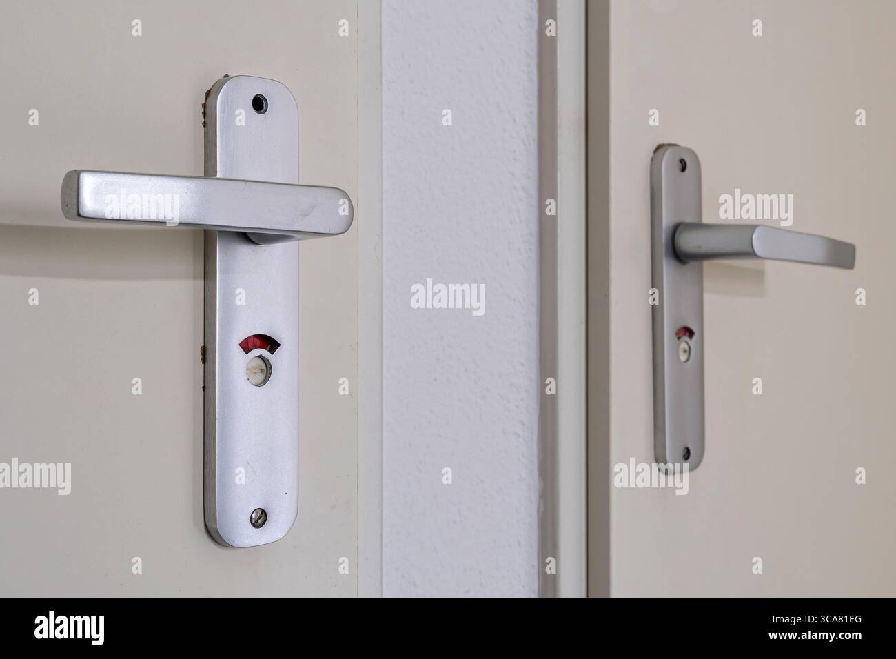 bathroom door handle showing occupied Stock Photo - Alamy