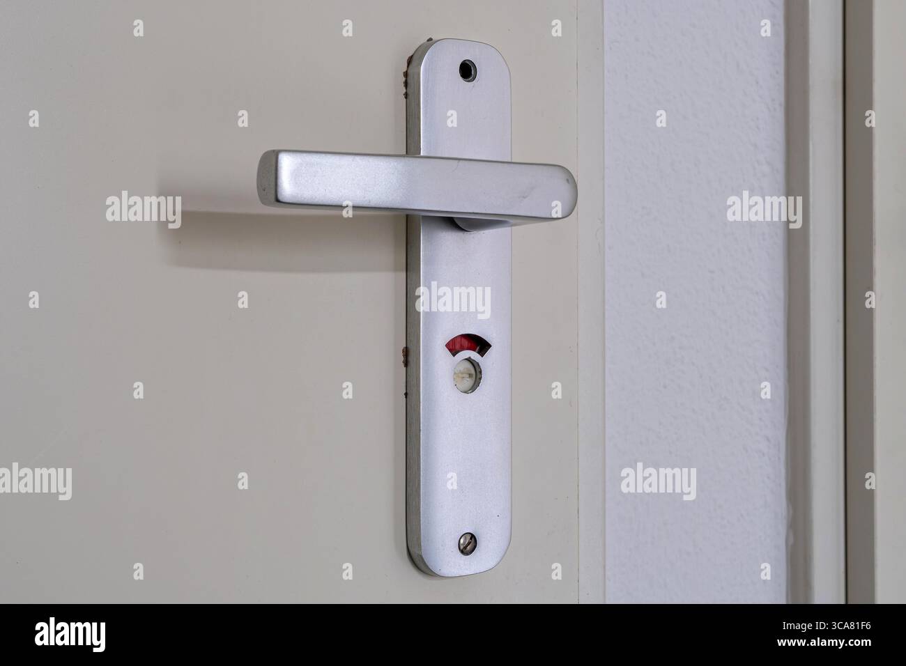 bathroom door handle showing occupied Stock Photo - Alamy