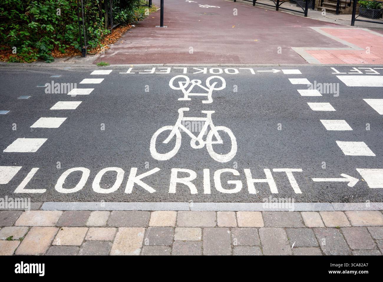 Cyclists road crossing point Stock Photo - Alamy