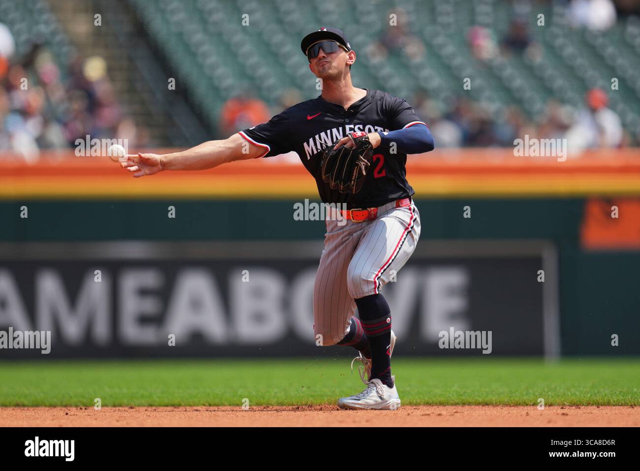 Minnesota Twins shortstop Brooks Lee throws to first base for an out on ...