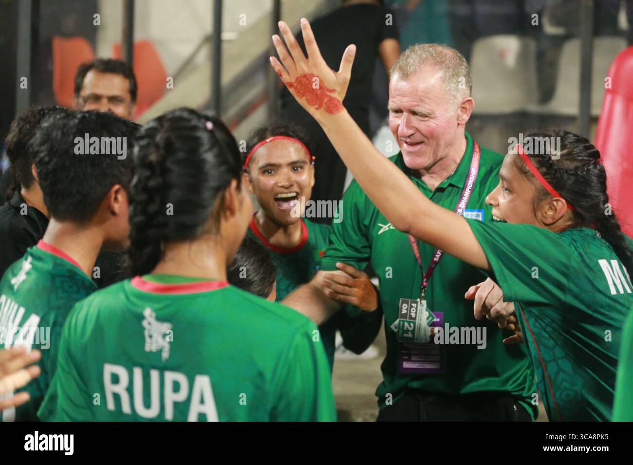 Bangladesh coach Peter Butler among the players they celebrate a title ...
