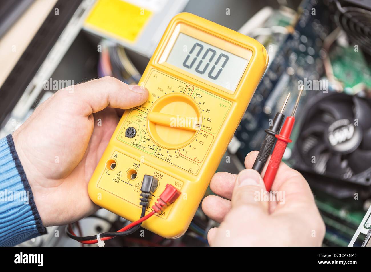 Technician hands holding voltmeter hi-res stock photography and images ...