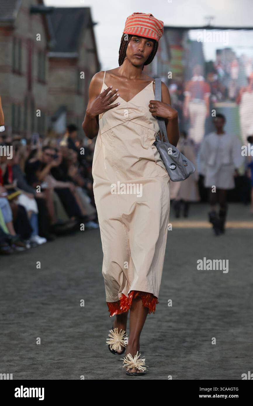 Copenhagen, Denmark. August 6, 2025. A model on the outdoor catwalk at the Baum und Pferdgarten ...