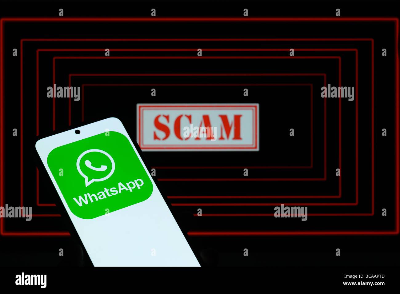 The WhatsApp logo is being displayed on a mobile phone with scam seen ...