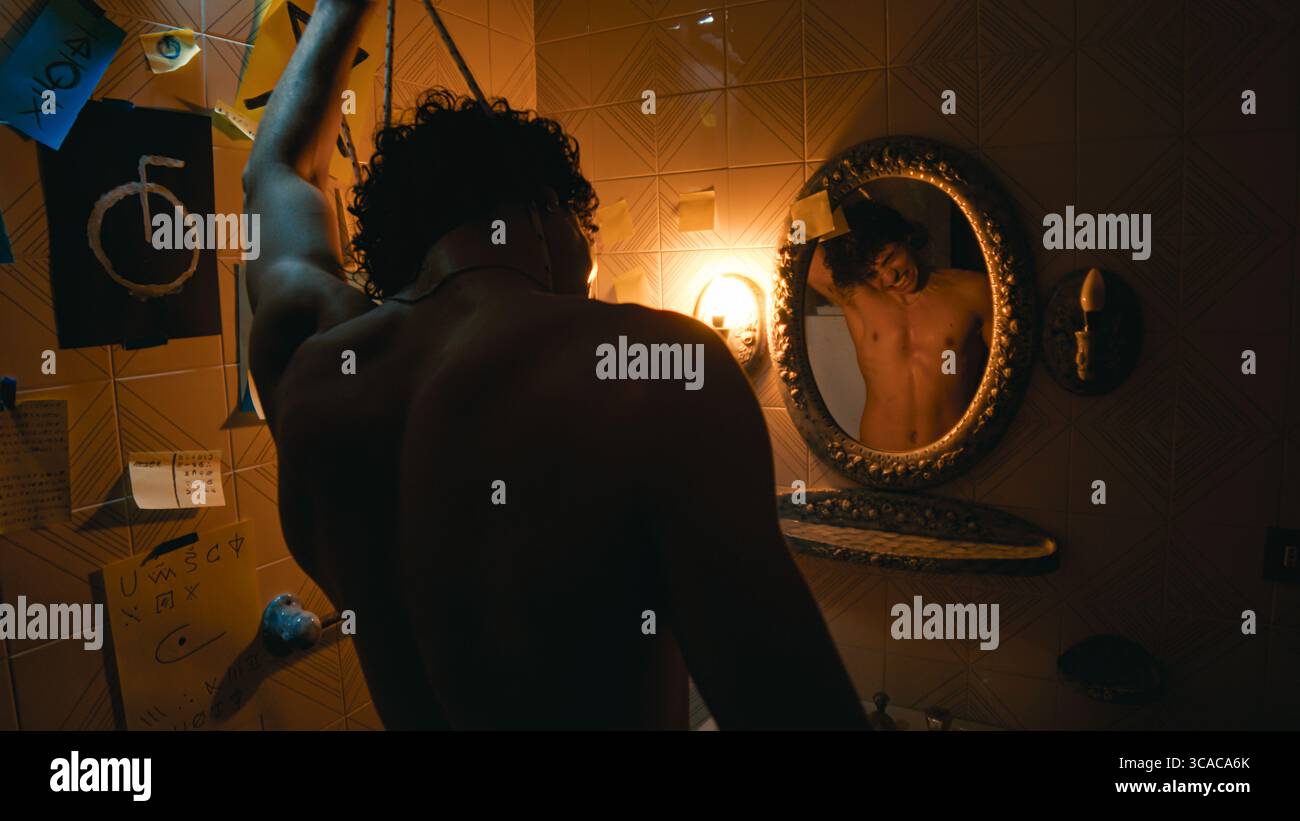 Man Using His Hands To Stretch The Rope On His Neck Stock Photo - Alamy