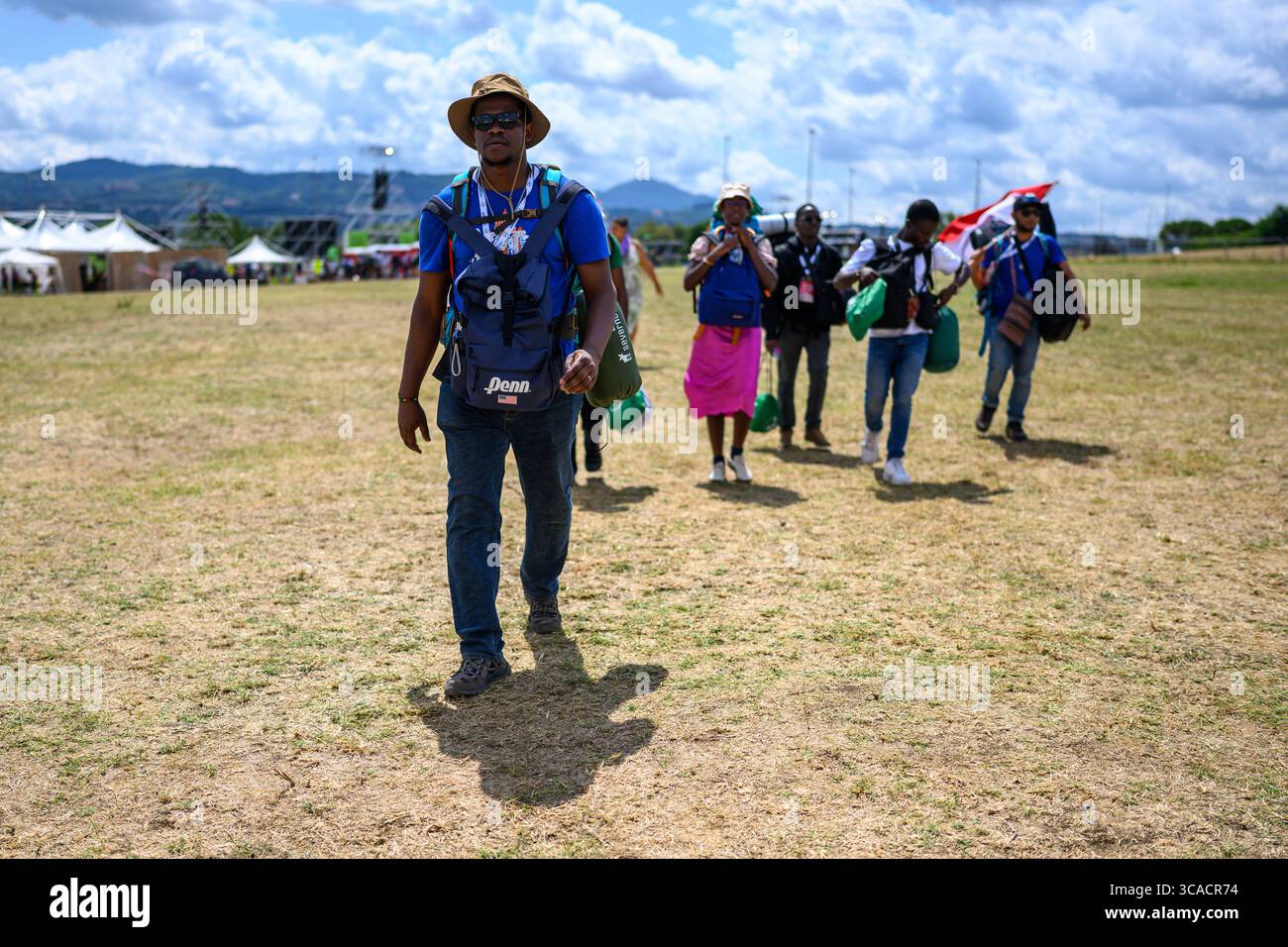Groups of pilgrims arriving at the Tor Vergata camp in Rome ahead of ...