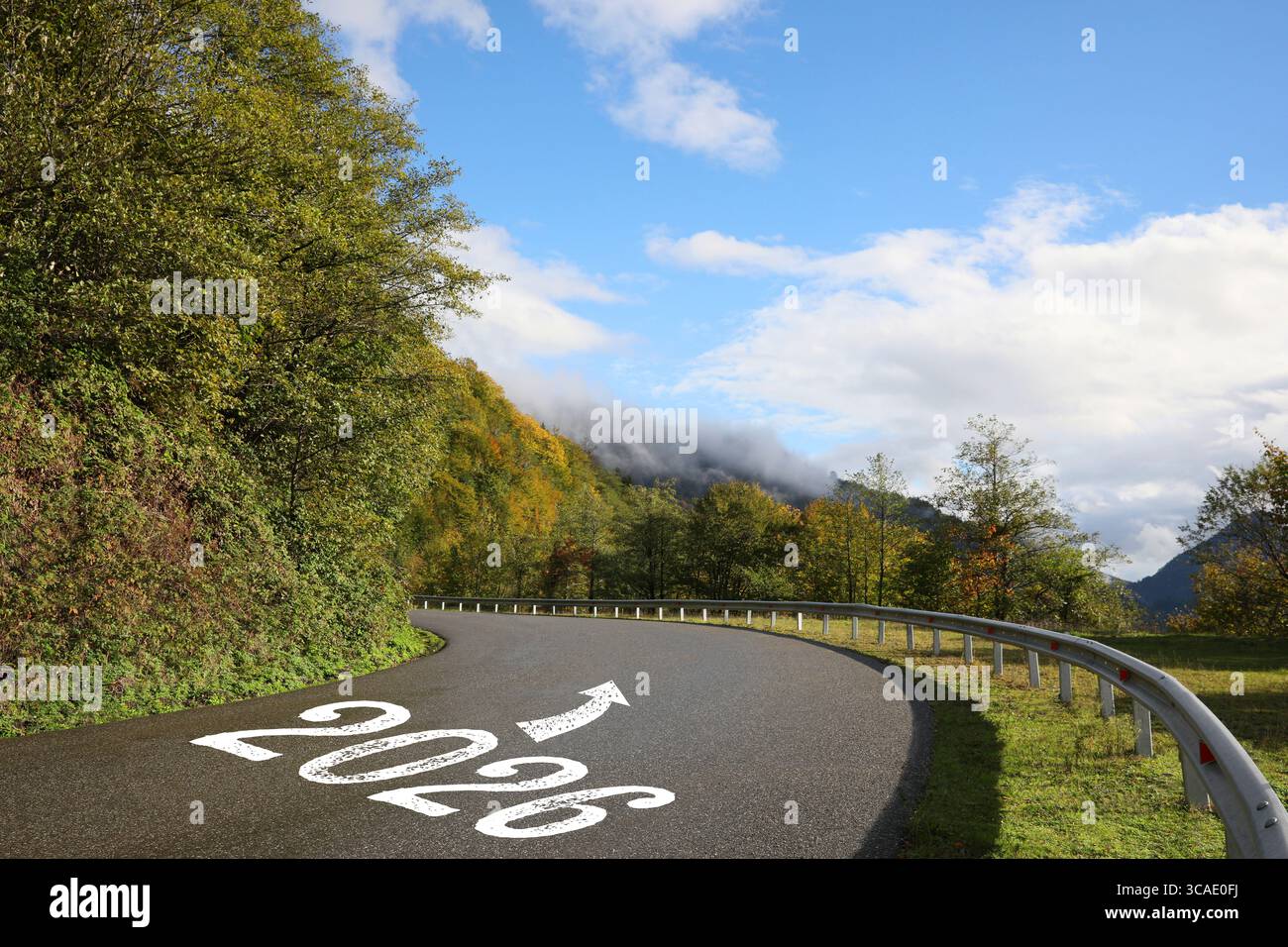 2026 on asphalt road in mountains. Hope and expectation for new year ...