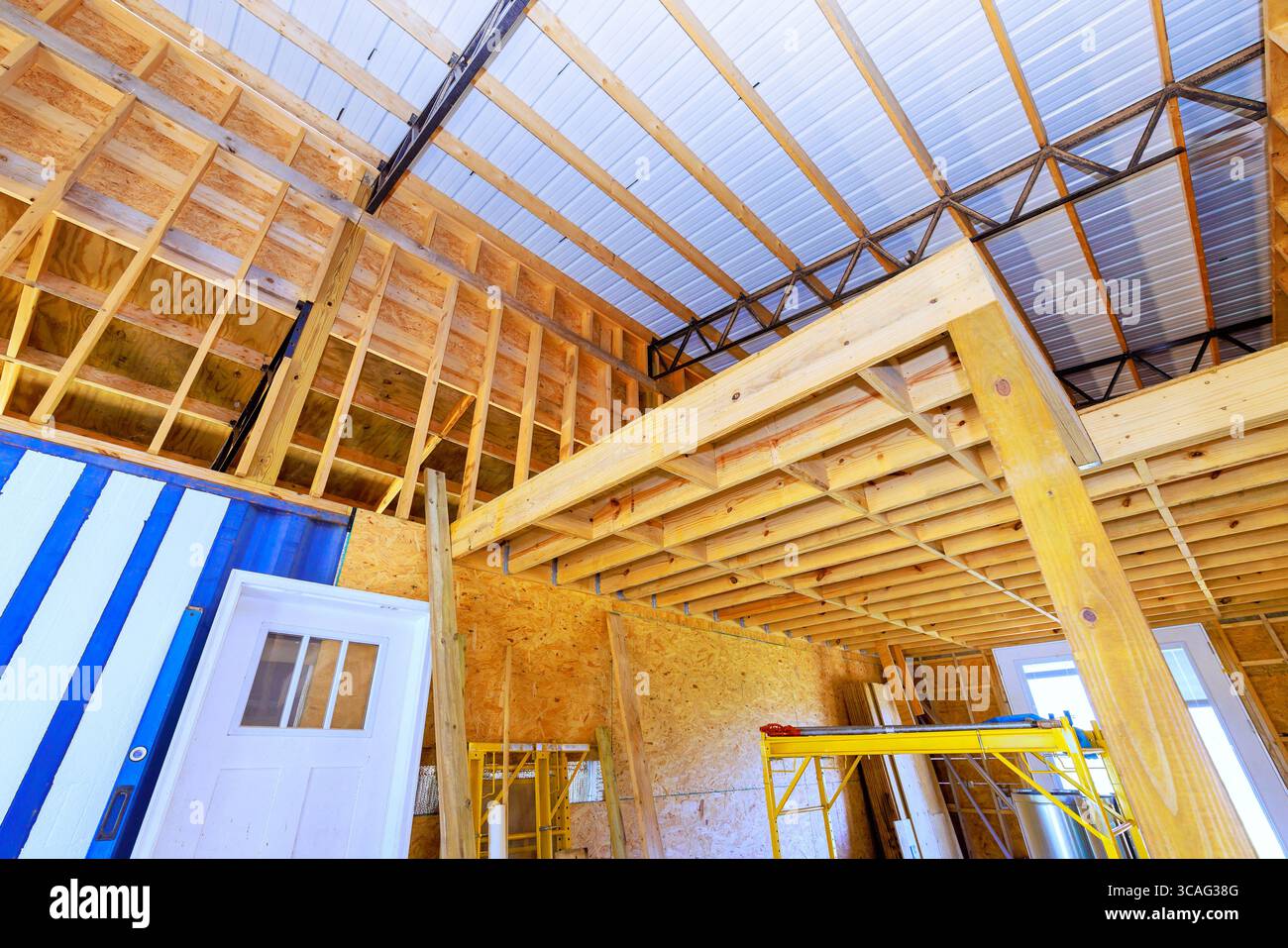 Construction underway inside building, wooden beams scaffolding in ...
