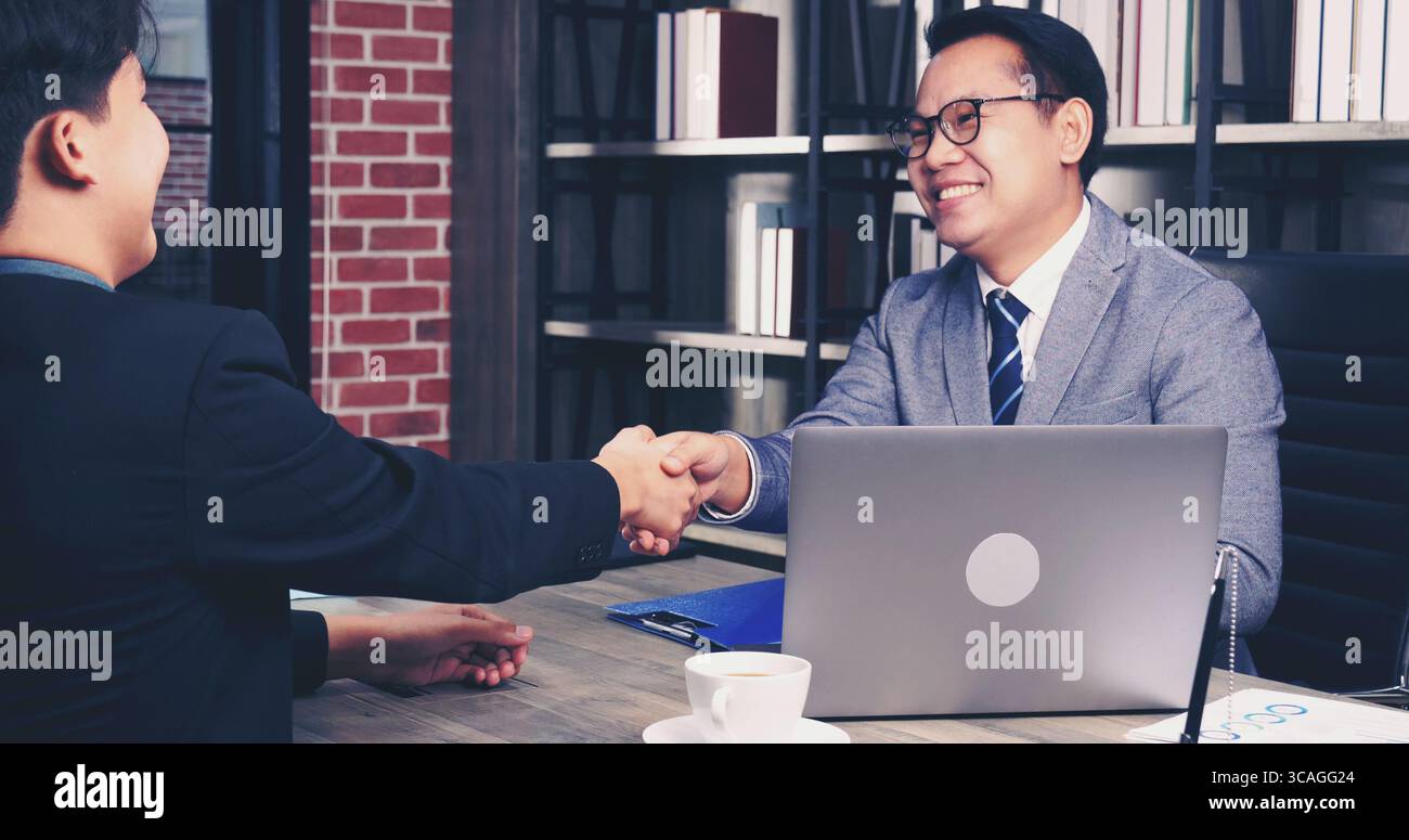 Success collaboration partners sign contract and shake hands after ...