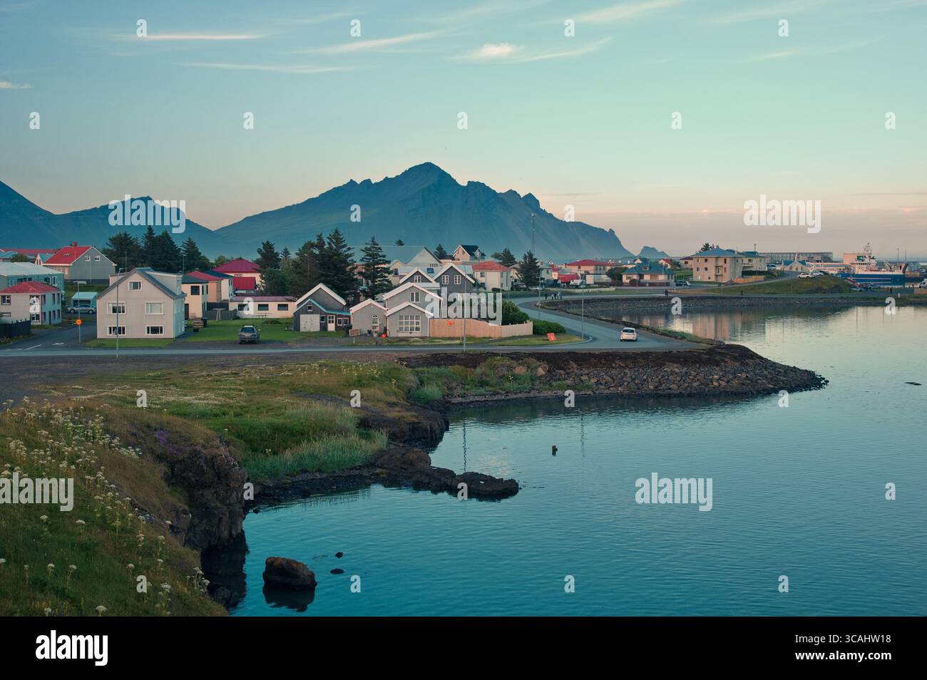 Scenic view of coastal town in Iceland during sunset Stock Photo - Alamy