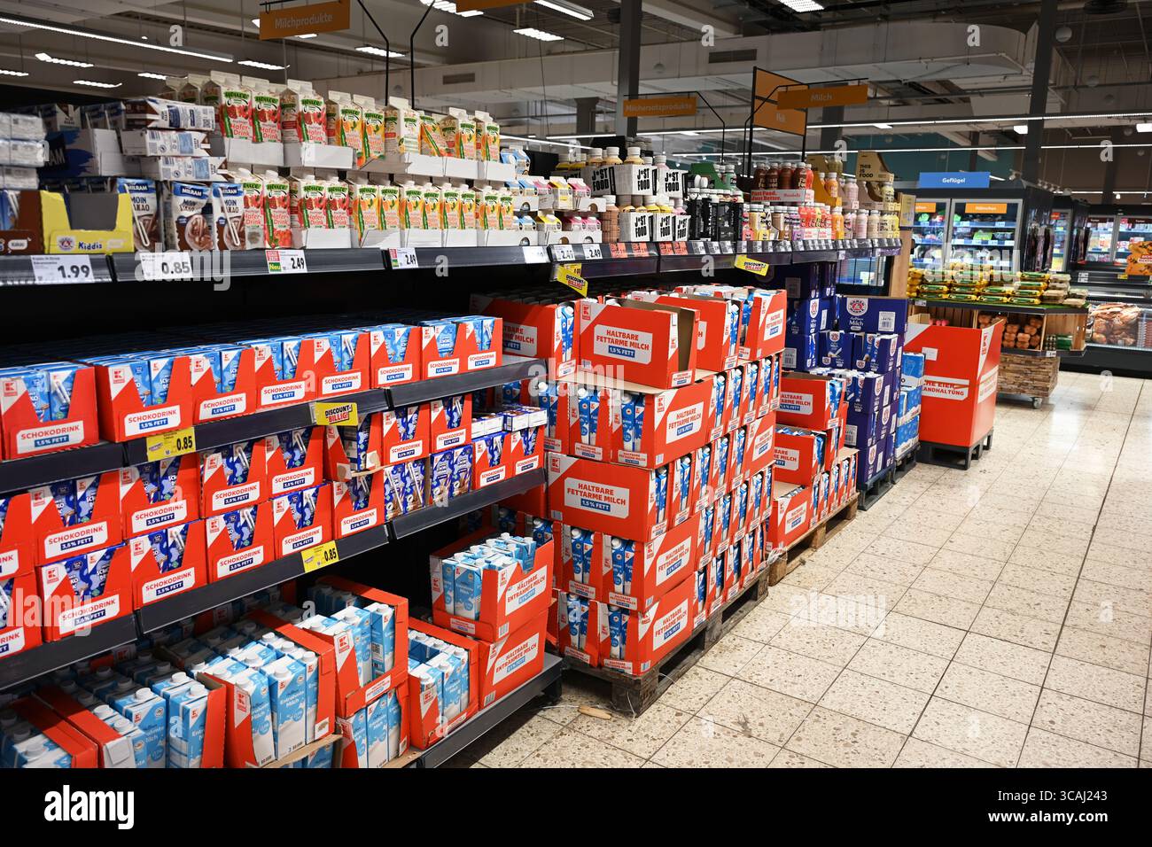 Milk cartons in cardboard boxes in a Grocery Stock Photo - Alamy