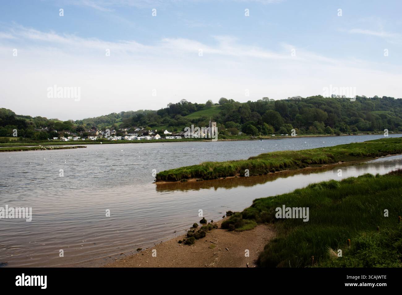 river estuary with buildings in the distance on the far bank Stock ...