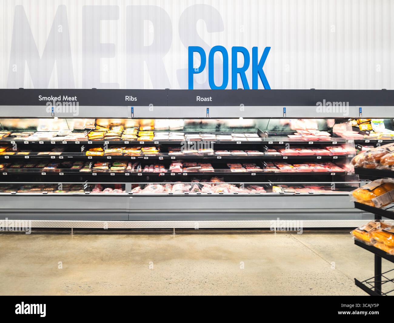 Rome, NY - Jul 20, 2025: Ultra-wide view of Walmart Supercenter pork ...