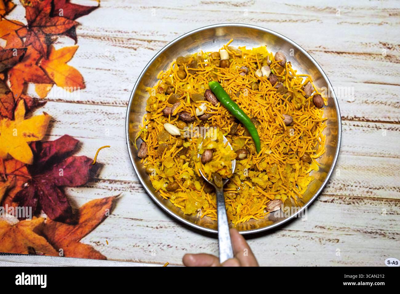 traditional indian poha breakfast with green chilli indoor Stock Photo ...