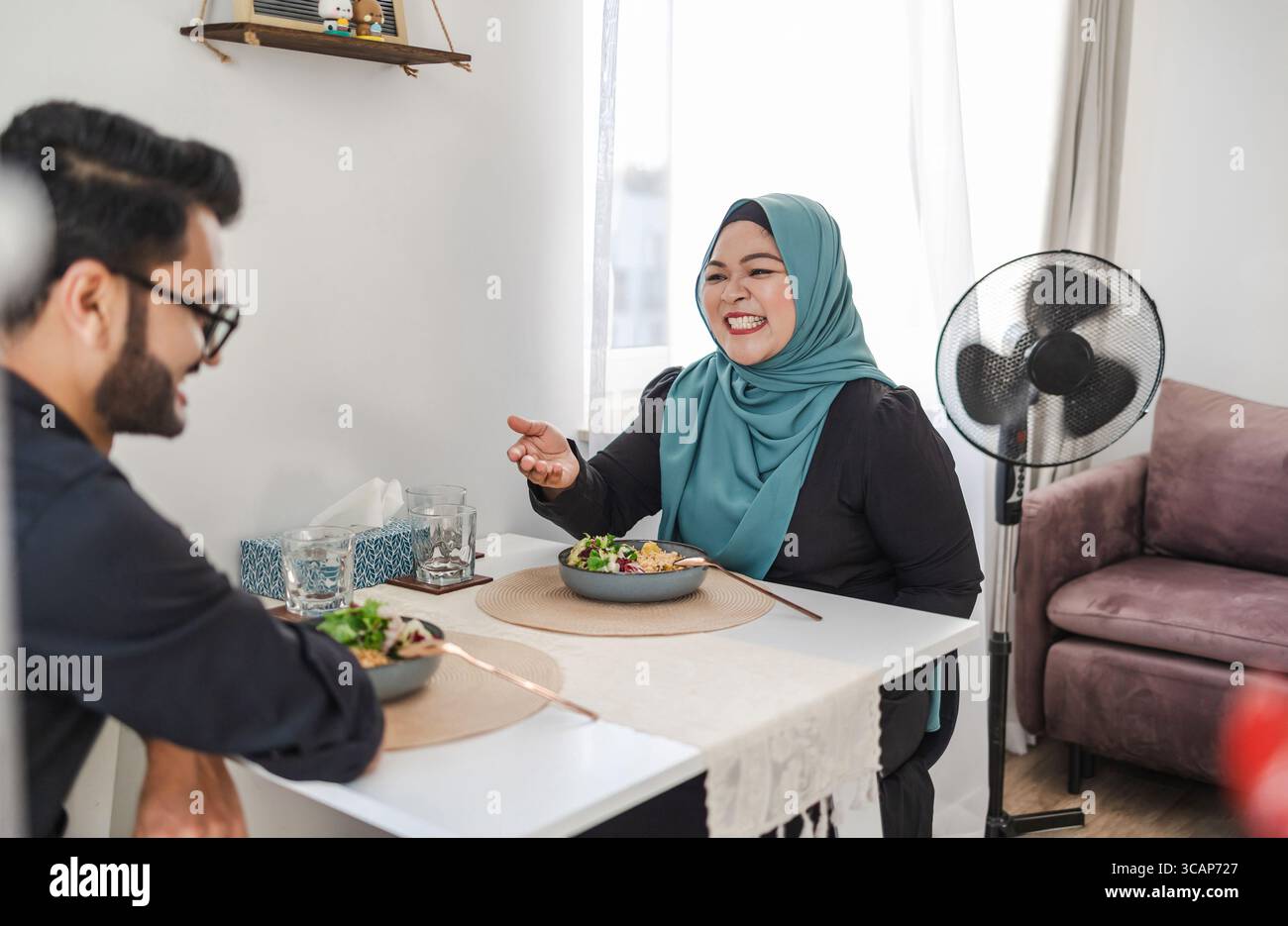 Candid woman eating meal apartment hi-res stock photography and images ...