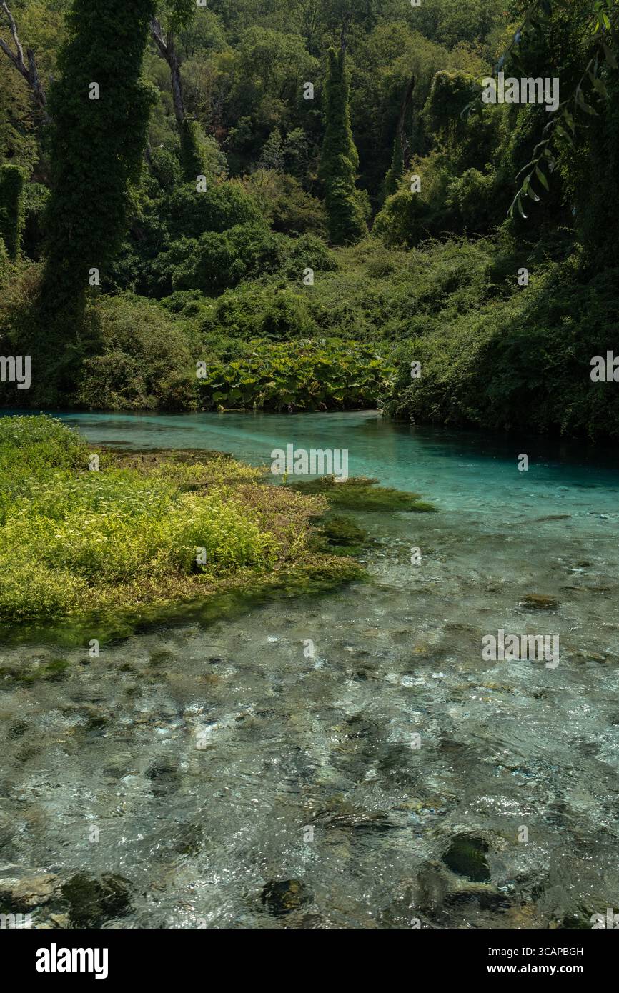 Blue Eye spring in Sarande, Albania, with flowing clear water, ripples ...