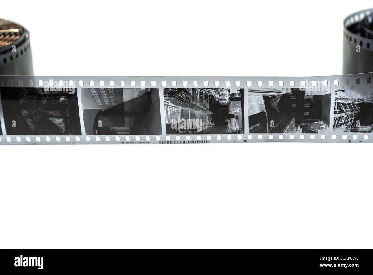 A detailed black and white film negative strip stretched out with ...
