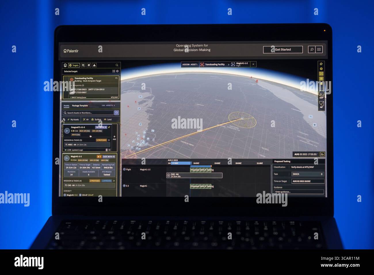 A laptop in the dark shows the user interface of the Palantir software ...