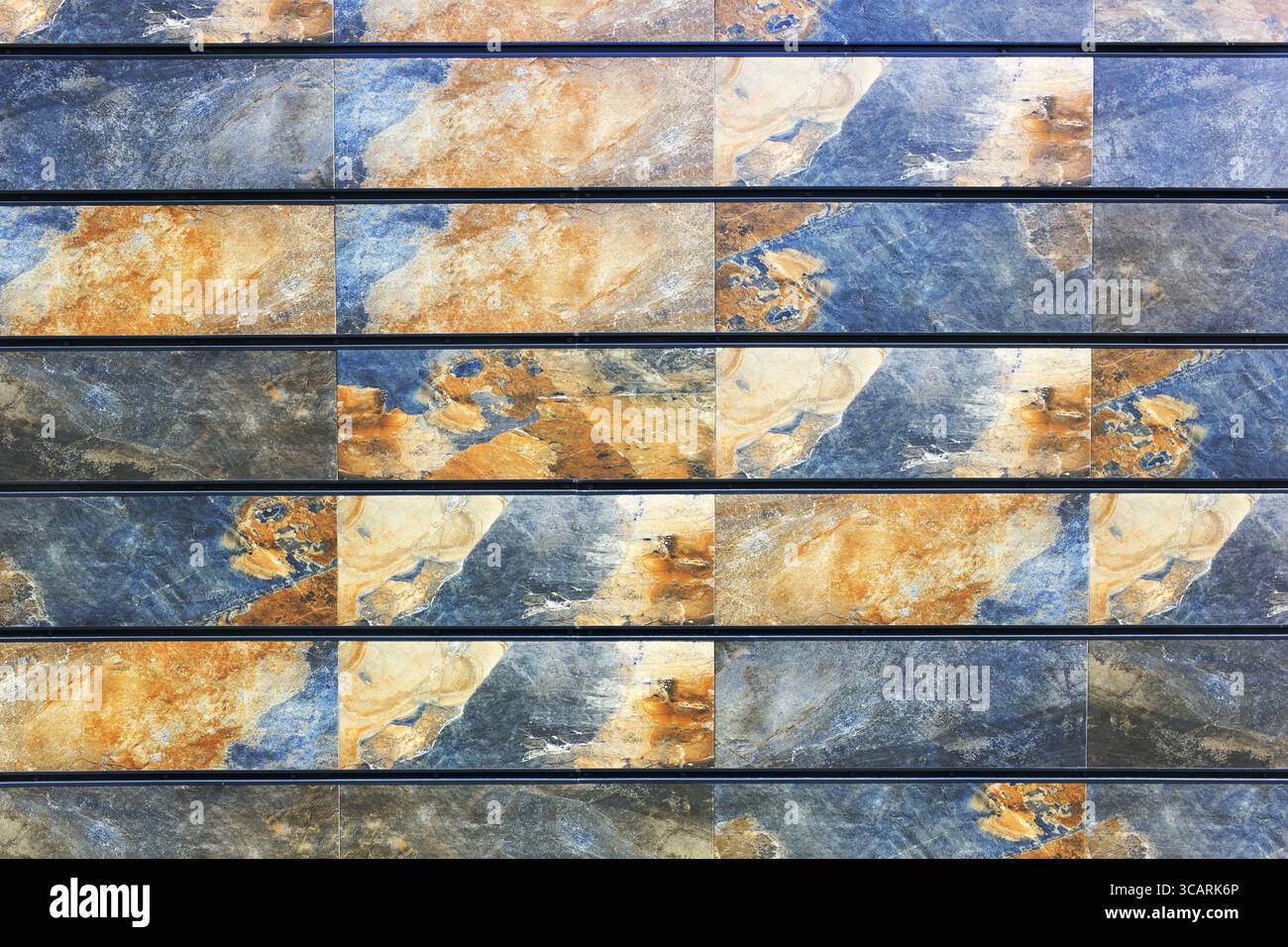The wall is fixed by rectangular stone plates with yellow blue space ...