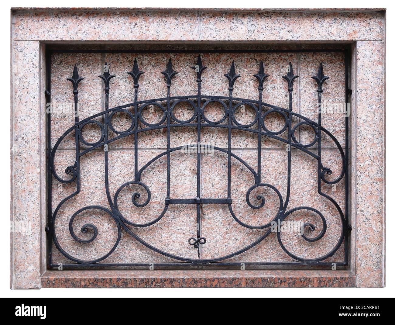 Black steel lattice in a rectangular niche of a red granite wall ...