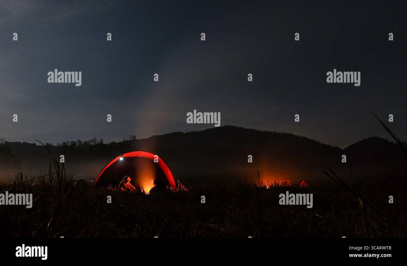 Camping tent bonfire under hi-res stock photography and images - Alamy