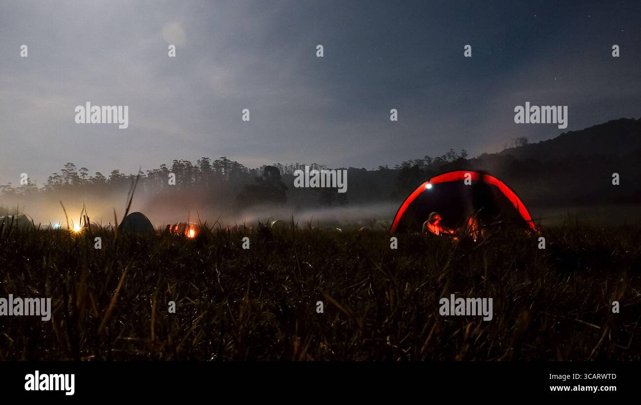 Camping tent bonfire under hi-res stock photography and images - Alamy