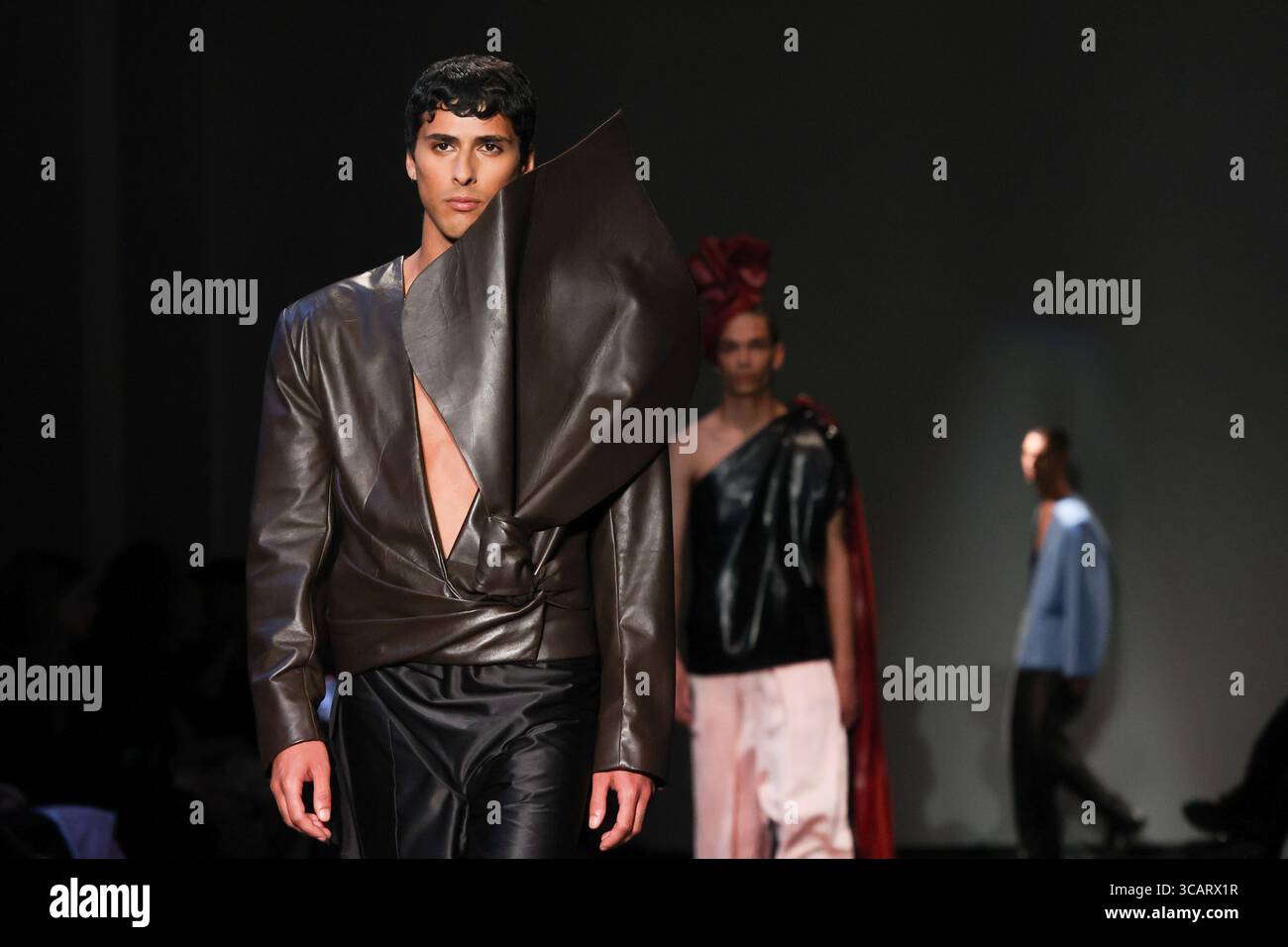 Copenhagen, Denmark. August 7, 2025. Models on the catwalk wearing a ...