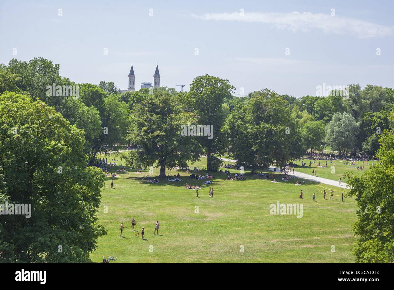 Englischer garten with church towers of the ludwigskirche hi-res stock ...