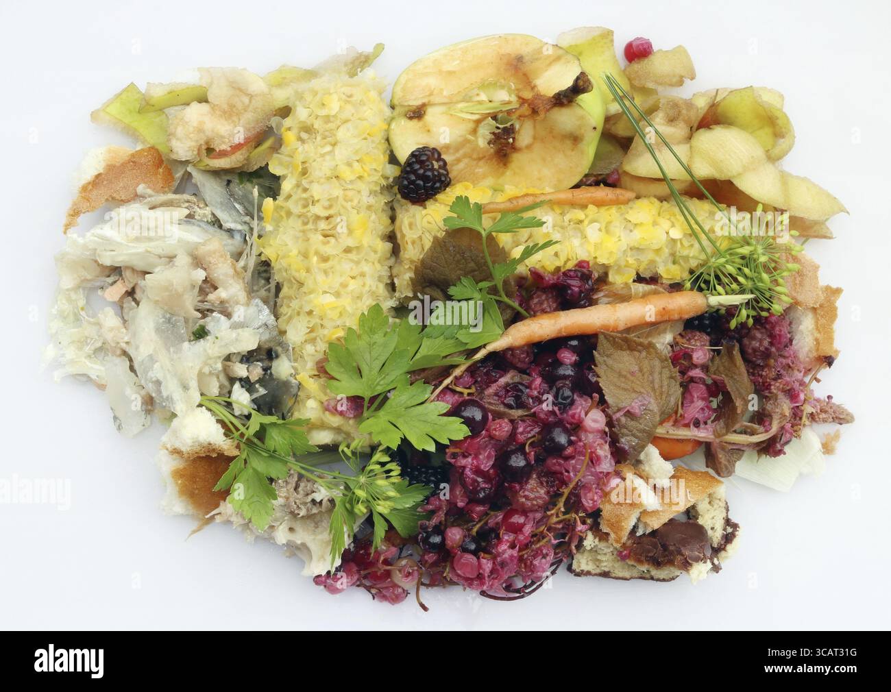 On the white kitchen table lie food waste, which remained when cooking ...