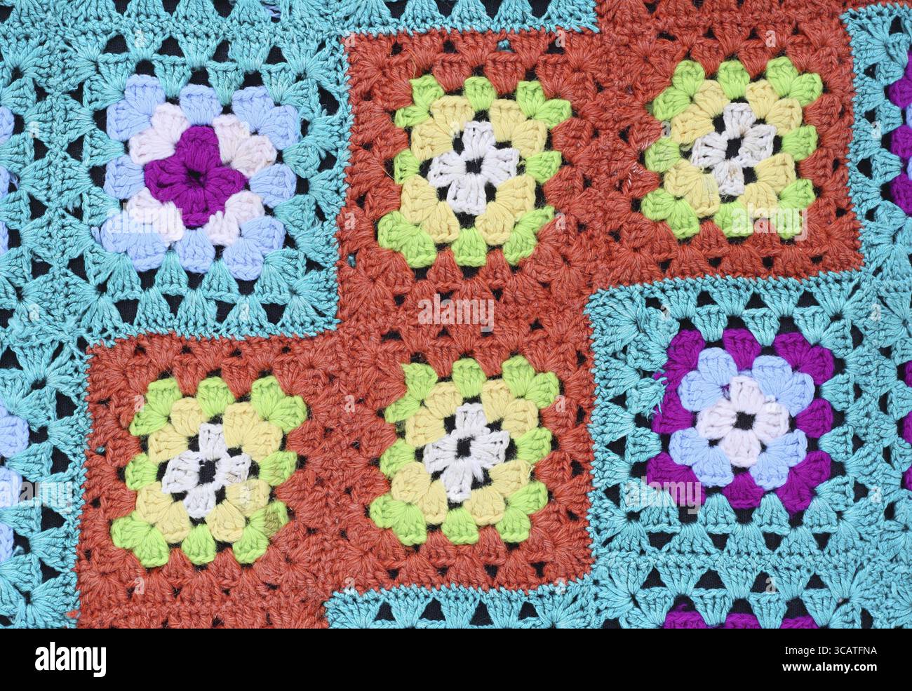 Abstract interlacing of knitted multi-colored fibres. The item is made ...